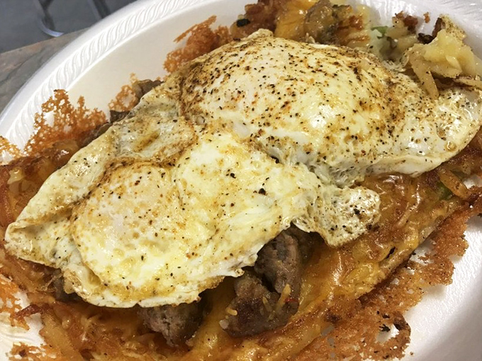 The "Hangover Hash Browns" aren't just a meal&mdash;they're therapy. Perfectly seasoned potatoes topped with eggs that ooze golden sunshine.