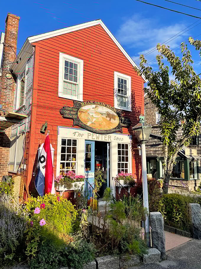 The Pewter Shop's vibrant red facade has been catching eyes on Bearskin Neck since 1935, beckoning collectors with hand-crafted maritime treasures.
