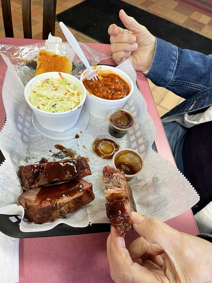 The Three-Bone Special tells you everything you need to know about life's priorities: great ribs, comforting sides, and a thumbs-up of approval.