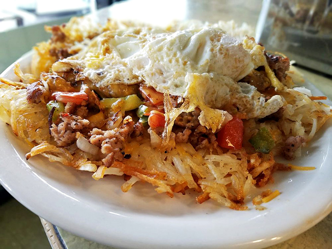 The ultimate loaded hash browns&mdash;where crispy potatoes meet savory ground beef, fresh vegetables, and a perfectly cooked egg. Breakfast architecture at its finest.