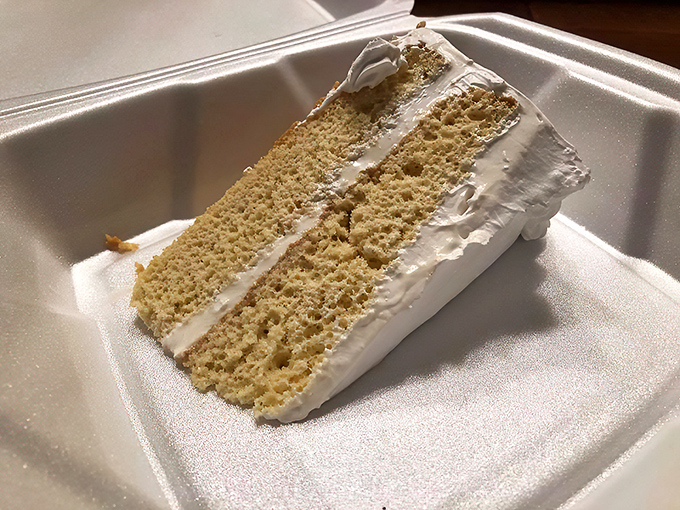 A perfect cross-section reveals the cake's secret&mdash;somehow magically soaked yet maintaining its structure. Engineering at its most delicious.