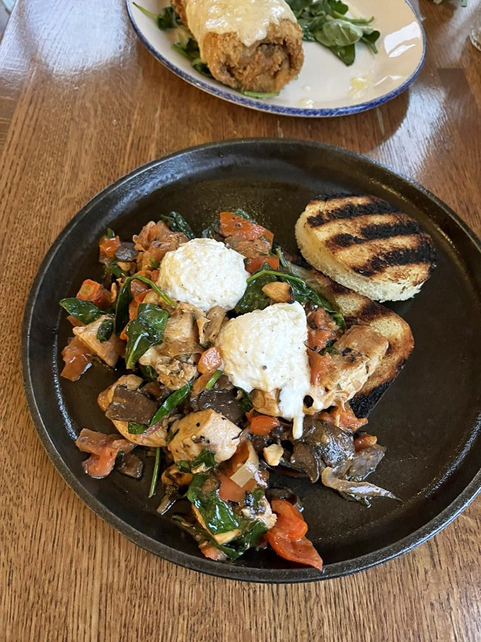 Whoever said vegetables can't be exciting hasn't seen this plate – a symphony of colors and textures topped with perfectly poached eggs.