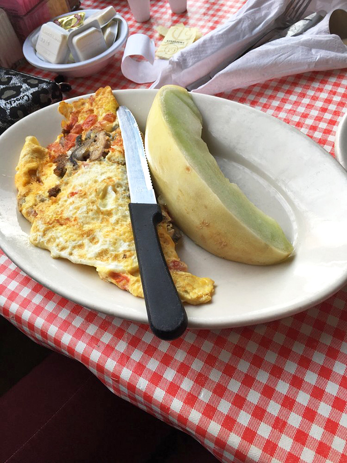 That's not just an omelet&mdash;it's a vegetable delivery system disguised as breakfast, complete with a slice of melon for "balance."