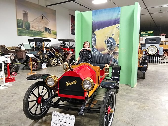 This vibrant red Hupmobile stands as a testament to early automotive craftsmanship, when cars were as much art as transportation.