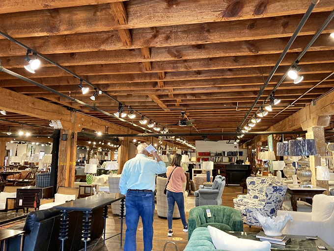 Beneath soaring wooden ceilings, shoppers discover furniture vignettes that inspire entire room makeovers - or dangerous credit card adventures, depending on your perspective.