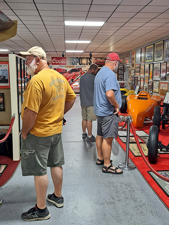 Gearheads in their natural habitat, studying the evolutionary timeline of speed machines with the focus of archaeologists at a dig site.