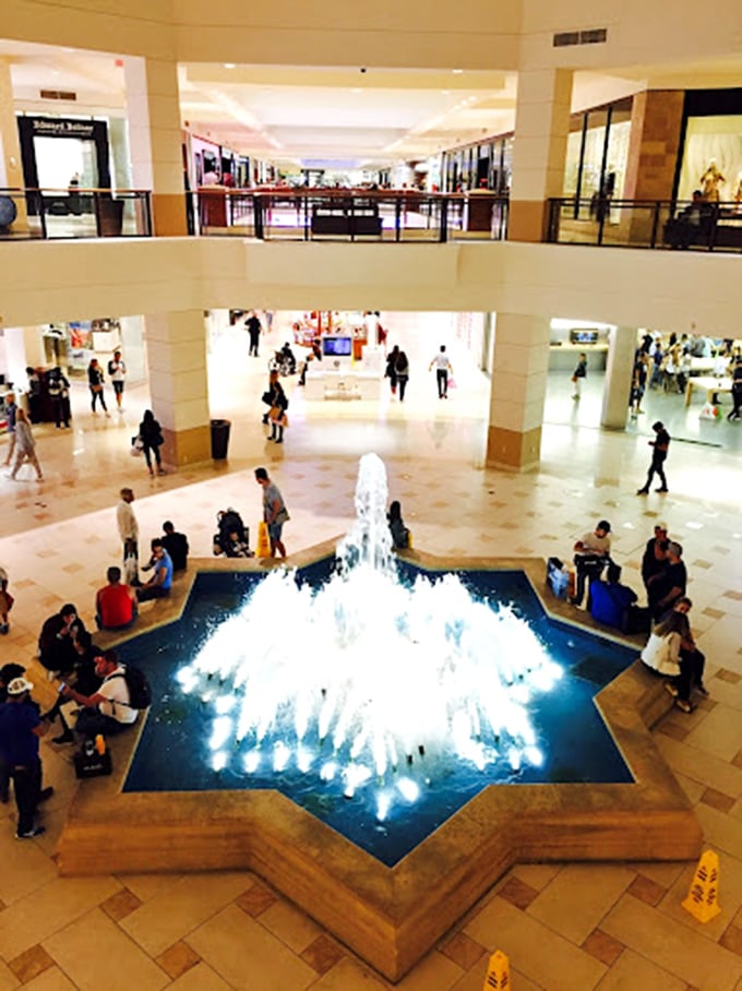 The star-shaped fountain serves as both meeting point and impromptu wishing well. "Dear Retail Gods, please let that designer bag be 70% off."