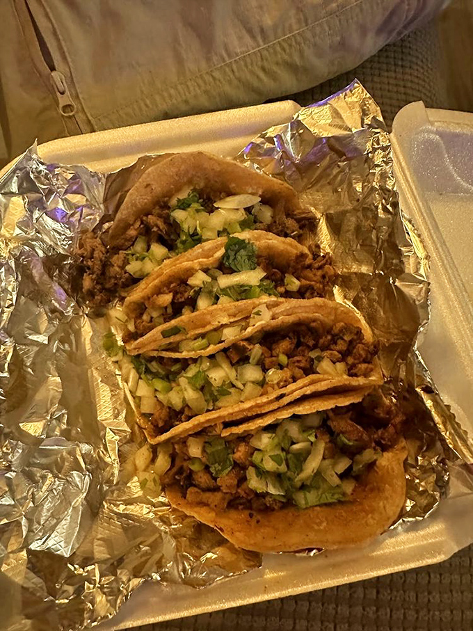 Street tacos as they should be – double corn tortillas cradling perfectly seasoned meat, topped with nothing more than fresh cilantro and onion. Perfection, simplified.