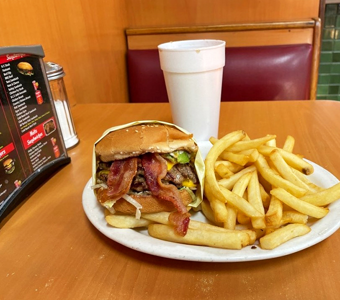 The bacon cheeseburger and fries combo—proof that sometimes the simplest pleasures in life require the most napkins.