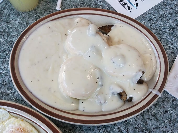 Biscuits swimming in creamy gravy—the kind of comfort food that makes you want to call your mother and thank her for everything.