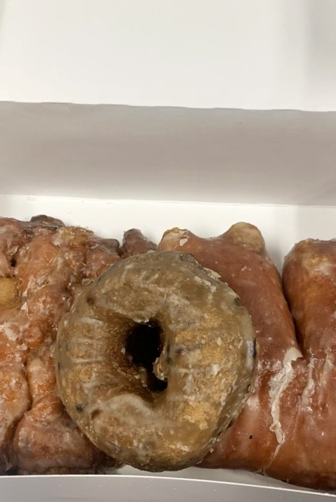 This apple fritter isn't just a donut &ndash; it's a commitment. Crispy, craggly edges giving way to tender, apple-studded interior worth every calorie.