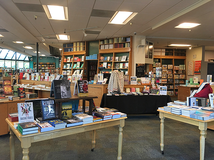Tables laden with carefully curated selections feel like having a brilliant, well-read friend who always knows exactly what you should read next.