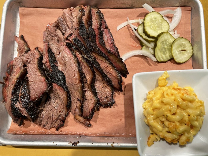 Brisket sliced thick enough to make a Texan weep with joy, paired with that golden mac and cheese that haunts your dreams.