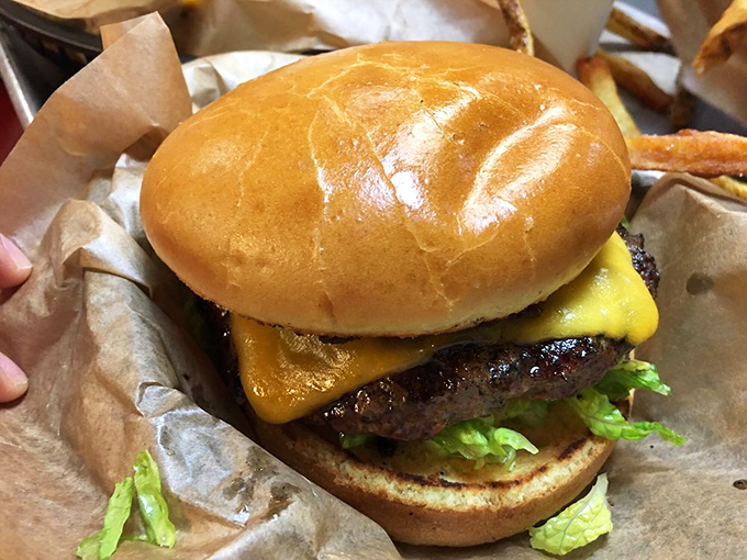 The golden ratio of bun-to-beef-to-cheese, with just enough green to pretend you're eating something healthy. Perfection in hand-held form.