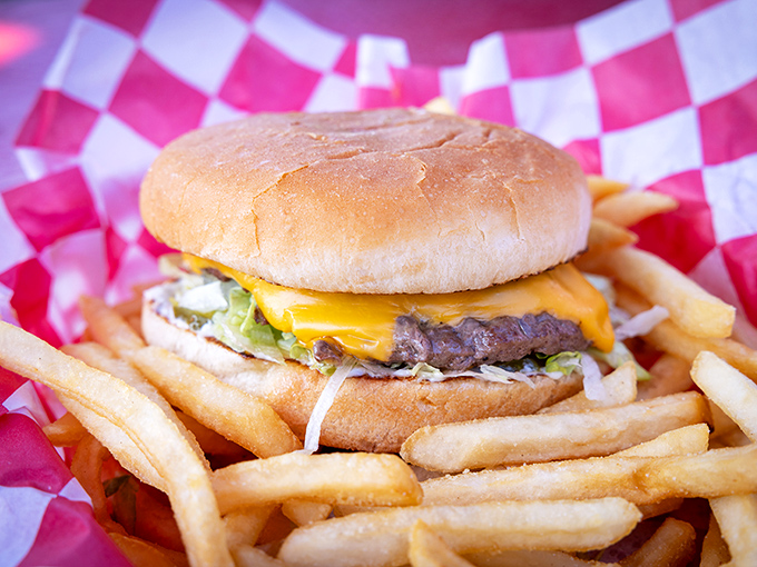 Golden fries surround a perfectly crafted cheeseburger &ndash; proof that sometimes the simplest pleasures deliver the most profound satisfaction. 