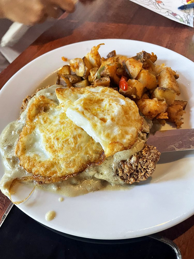 Southern cooking's holy trinity: perfectly crispy chicken fried steak, creamy mashed potatoes, and collard greens that would make your grandma nod in approval. 
