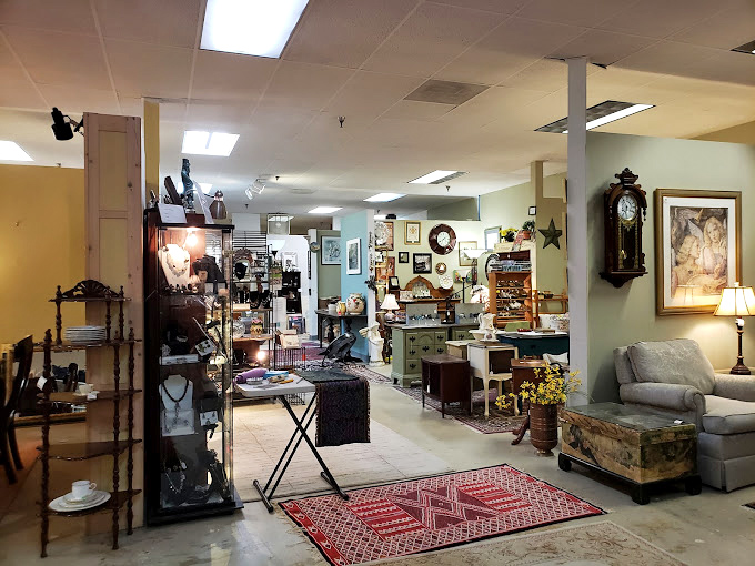 Antique clocks and artwork create an eclectic gallery wall that's part museum, part time machine, and entirely mesmerizing to explore.