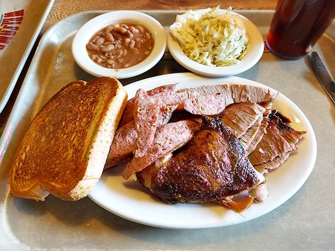 A meat lover's dream team: brisket, sausage, and all the fixings. This isn't a meal; it's a celebration on a plate.
