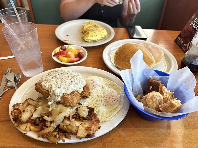 Breakfast nirvana achieved: golden-brown country fried steak, crispy home fries, fluffy pancakes, and pastries that make you question why you ever settled for cereal.