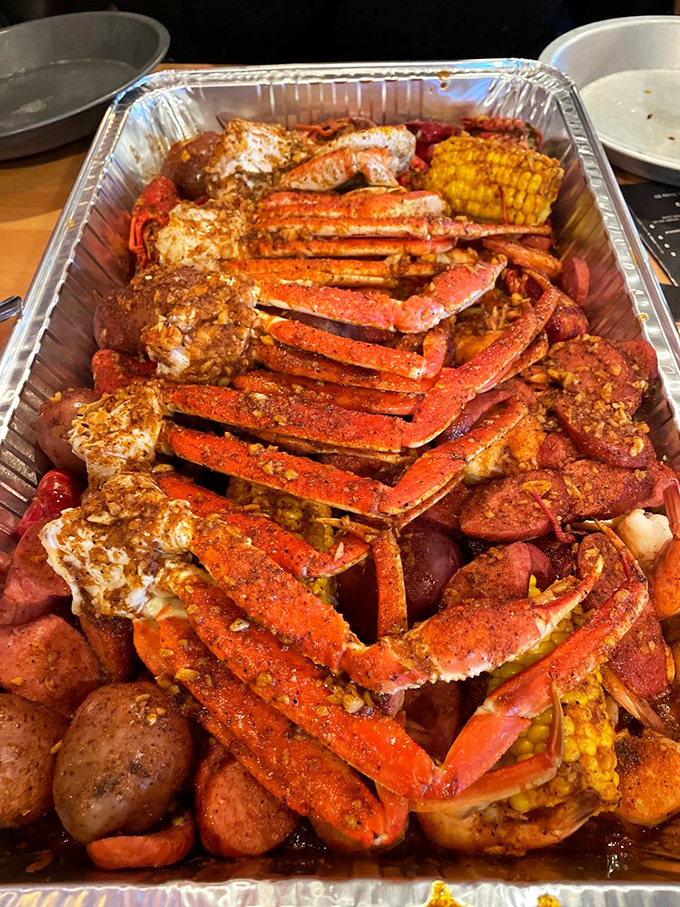 Snow crab legs arranged with military precision, seasoned to the edge of reason. The corn and potatoes aren't sidekicks&mdash;they're flavor sponges.