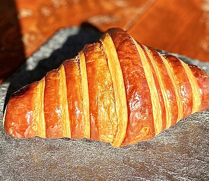 Behold the humble croissant in its natural glory. Those layers aren't just pastry—they're golden tickets to butter heaven.