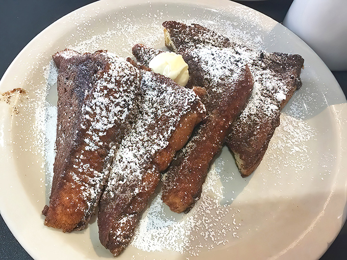 French toast that's achieved golden-brown perfection, dusted with powdered sugar. Simple pleasures executed with five-star technique.