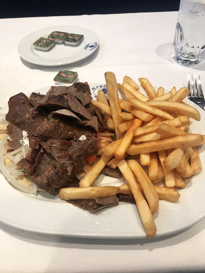 The classic gyro and fries combo&mdash;where seasoned meat meets golden potatoes in a partnership more harmonious than Simon and Garfunkel.