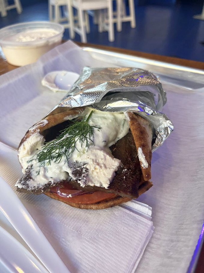 The perfect gyro reveals its secrets: Succulent meat, fresh veggies, creamy tzatziki, and herbs that make you wonder why you ever ate anything else