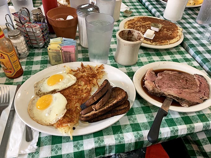 The holy trinity of breakfast perfection: sunny-side up eggs, crispy hash browns, and toast ready for yolk-dipping adventures.