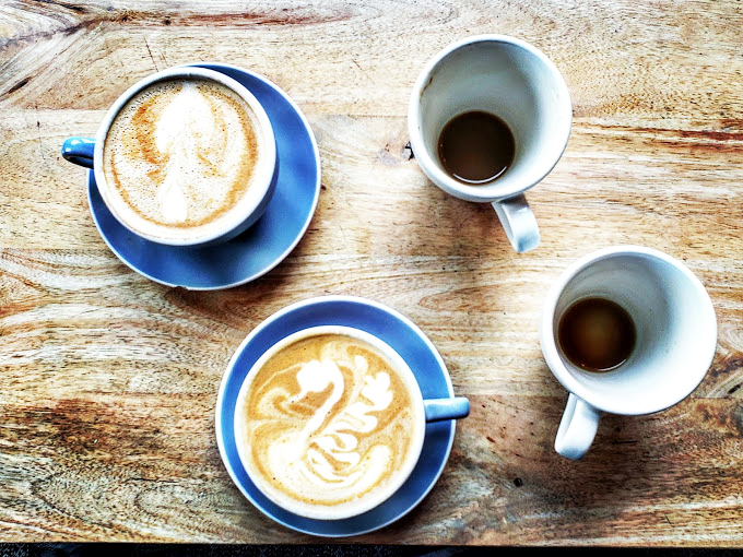 Four vessels of caffeinated perfection that make you wonder if baristas are actually undercover artists who couldn't afford studio space.