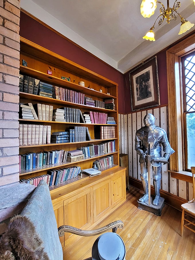 Every castle needs a proper library, complete with knight in shining armor standing guard over leather-bound treasures.