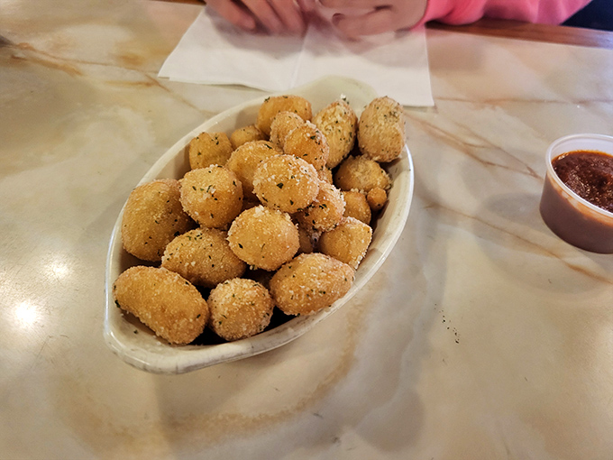 These aren't just any cheese nuggets&mdash;they're little golden orbs of happiness waiting to unleash molten joy with each bite. Marinara sauce standing by for duty.