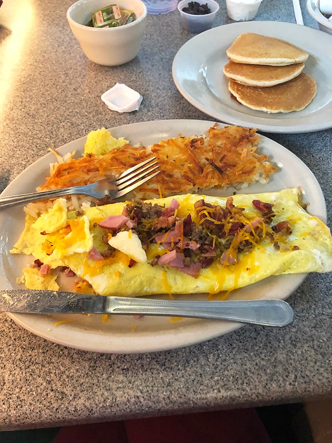The Denver omelet that could feed a small country, paired with golden hash browns and fluffy pancakes. Breakfast of champions, indeed.