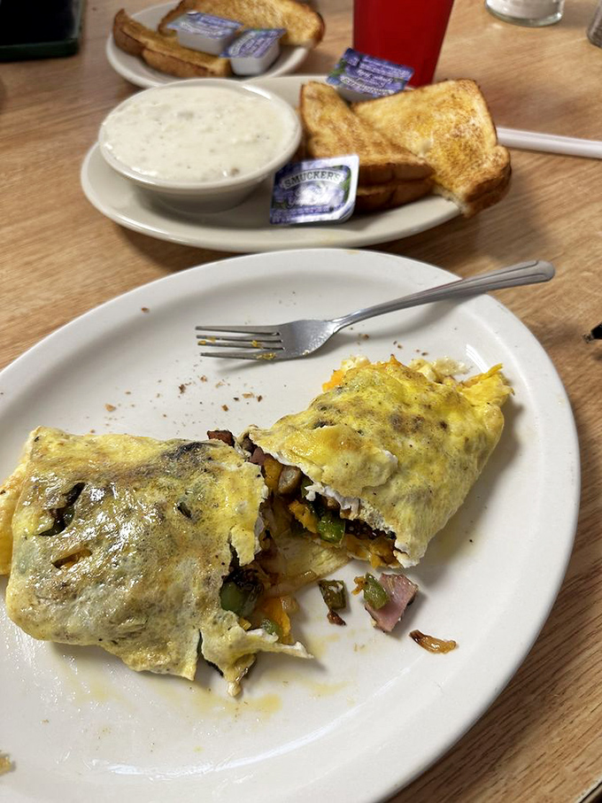 This omelet has more stuffing than your grandmother's Thanksgiving turkey, with every bite revealing a new treasure of ingredients.