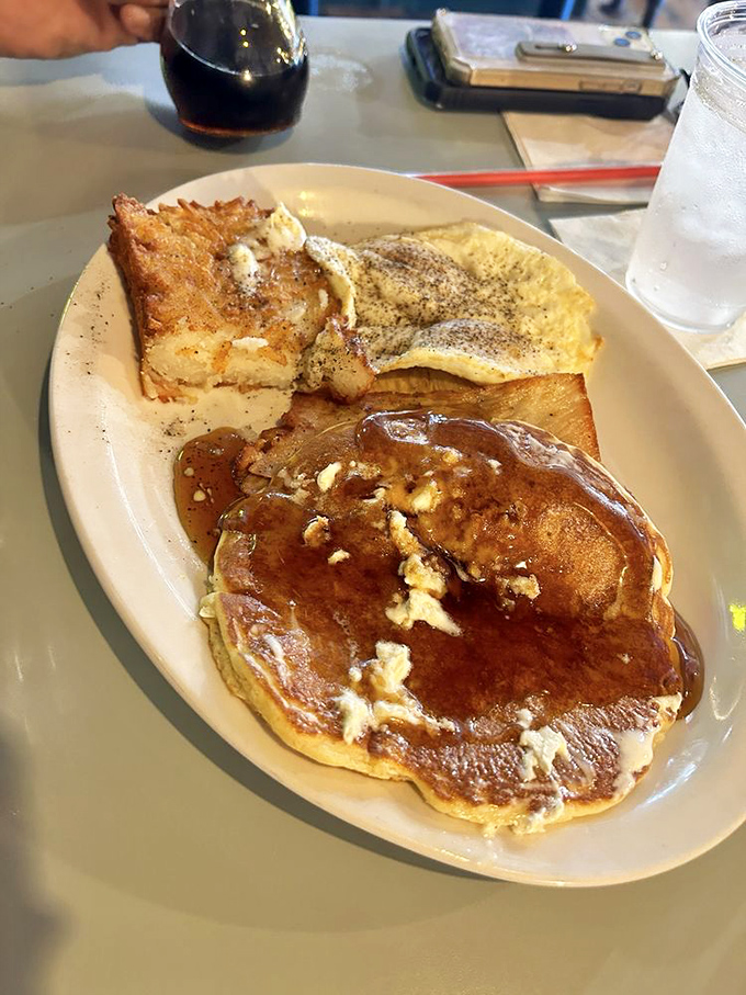 Breakfast alchemy at its finest&mdash;pancakes, eggs, and toast forming the holy trinity of morning satisfaction.