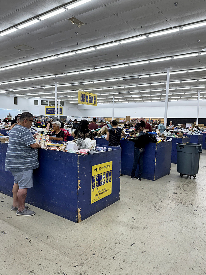 The archaeological dig of retail! Shoppers carefully excavate through layers of merchandise, each hoping to uncover that perfect artifact of value.