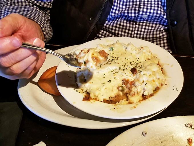 The moment of truth &ndash; when fork meets shepherd's pie and resistance is not only futile but foolish. Those browned potato peaks hold secrets only your taste buds can decode.