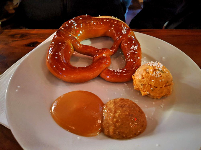 Behold the pretzel in its natural habitat: glistening, salt-flecked, and accompanied by mustard that means business.