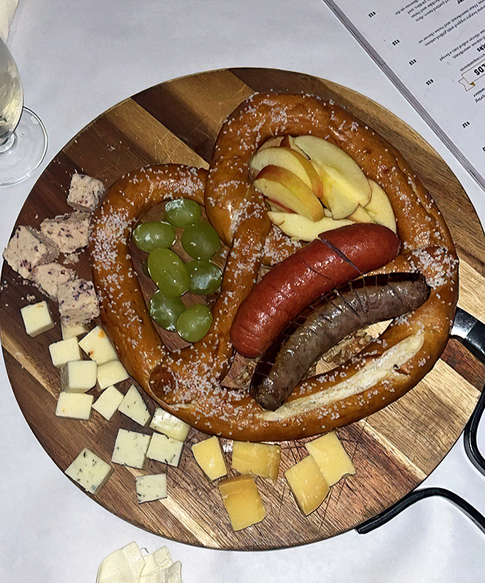 A wooden board bearing sausages, cheese, and the MVP&mdash;a giant pretzel. It's like a Bavarian Greatest Hits album on a plate.