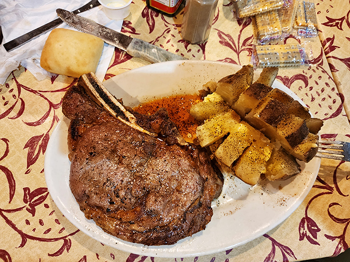 The ribeye doesn't need fancy garnishes when it's this good. Seasoned crust, buttery potatoes, and a roll that's begging to sop up those meat juices.