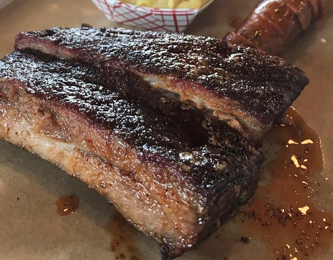 These ribs have the kind of bark that nobody wants to silence. The perfect marriage of smoke, spice, and time creates a symphony for your taste buds.
