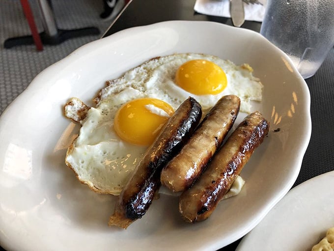 These sausages aren't just breakfast links; they're meaty exclamation points to a perfect morning, paired with eggs that practically glow with freshness.