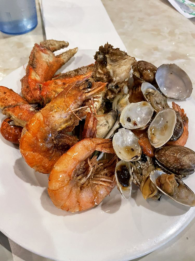 Crab legs and honey walnut shrimp share real estate on this plate&mdash;a property value that would make any Portland realtor jealous. 