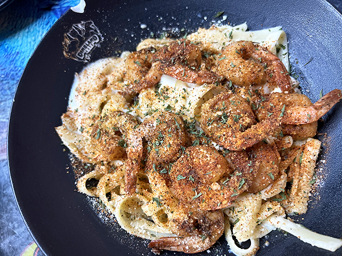 Pasta and shrimp unite in this dish that proves seafood has been delicious since prehistoric times. The parmesan sprinkle adds a modern touch to ancient appetites.