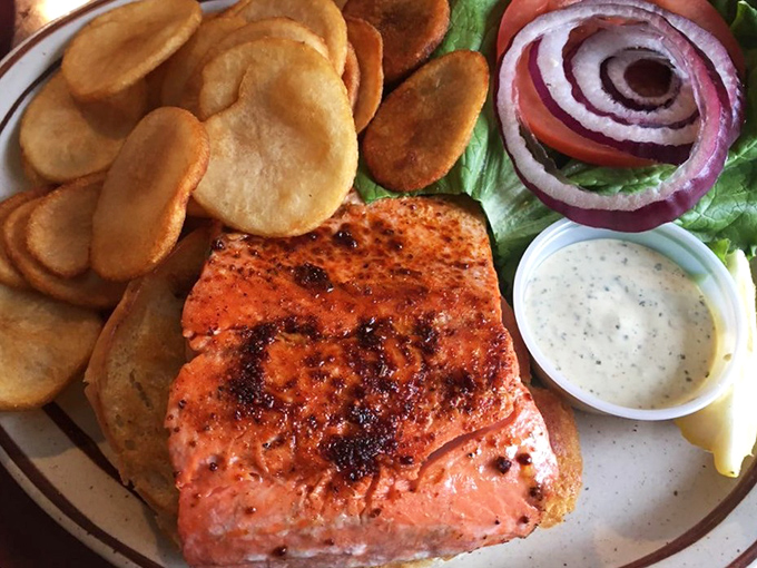 The sockeye salmon sandwich&mdash;proof that perfection doesn't need fancy tricks, just fresh fish, simple seasonings, and someone who knows exactly what they're doing.