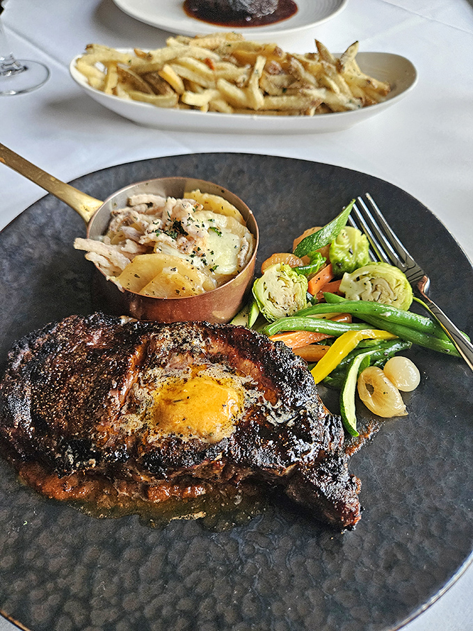 A steak so perfectly charred it should have its own Instagram account, accompanied by vegetables that aren't mere afterthoughts. Photo credit: Josh Burkett