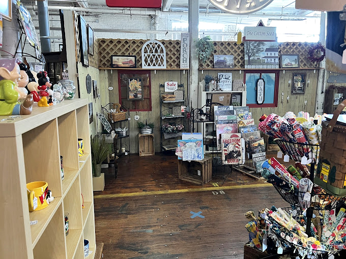 Each vendor booth tells a different story—this one a charming farmhouse fantasy complete with weathered wood and nostalgic treasures.