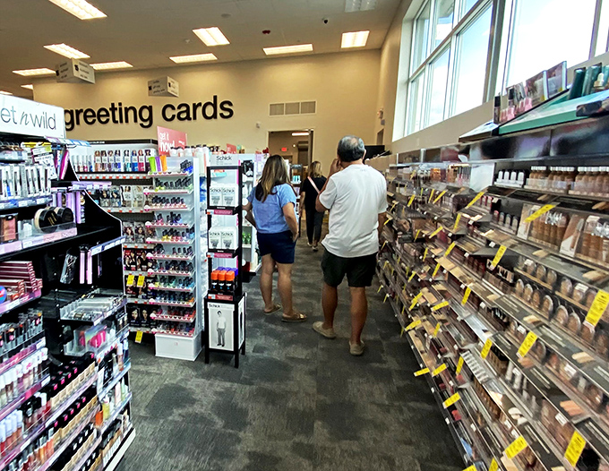 The greeting card aisle: where shoppers pause between wallet-emptying sprees to remember they should probably bring something home for others too.