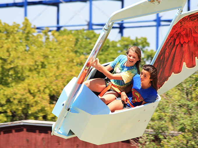 Pure joy captured mid-flight! These riders demonstrate the universal language of amusement parks: part terror, part delight, and completely unforgettable.