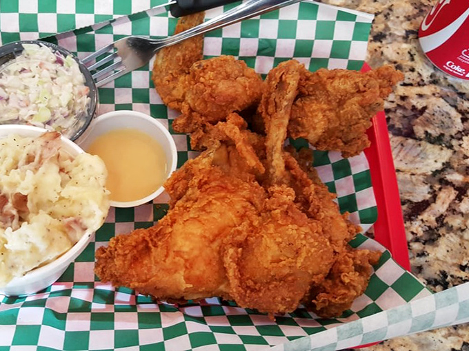 A classic basket of crispy wings with sides that know their supporting role. That checkered paper says "we're serious about casual" in the best way.
